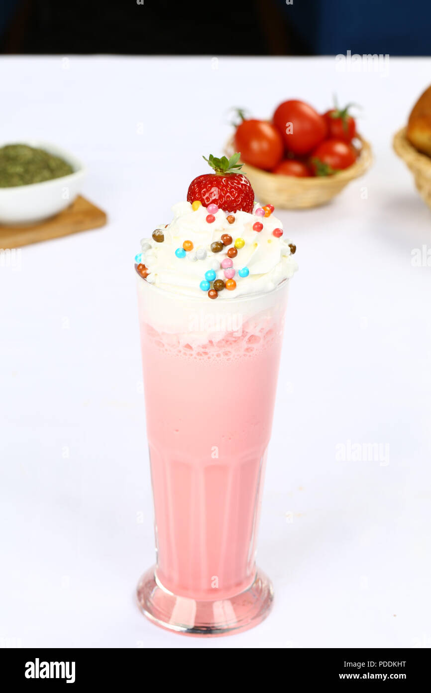 Strawberry Milkshake cocktail with whipped cream Stock Photo - Alamy