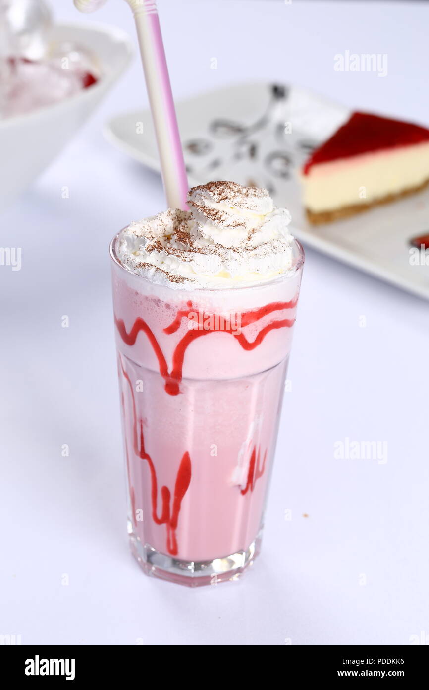 Strawberry Milkshake cocktail with whipped cream Stock Photo - Alamy
