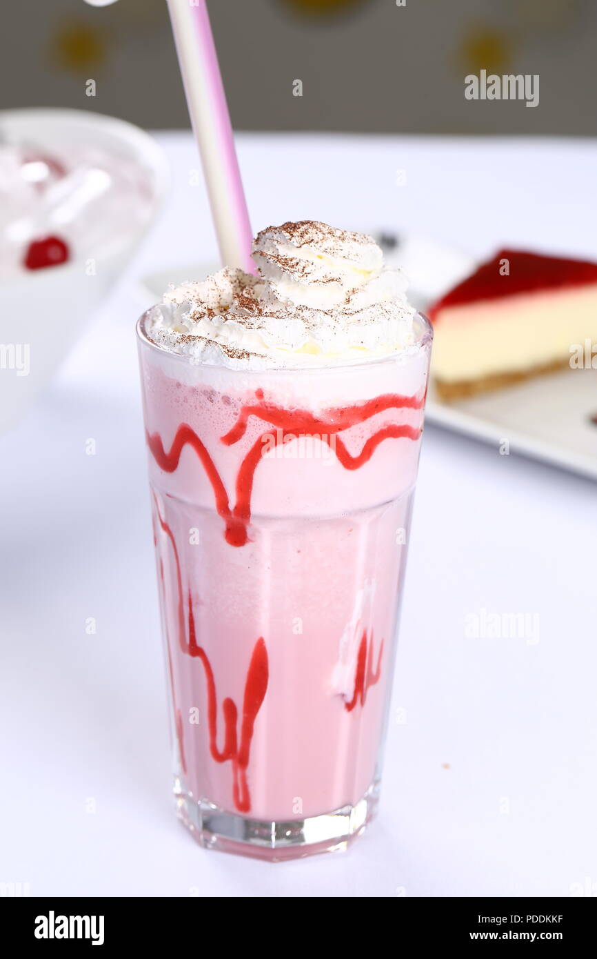 Strawberry Milkshake cocktail with whipped cream Stock Photo - Alamy
