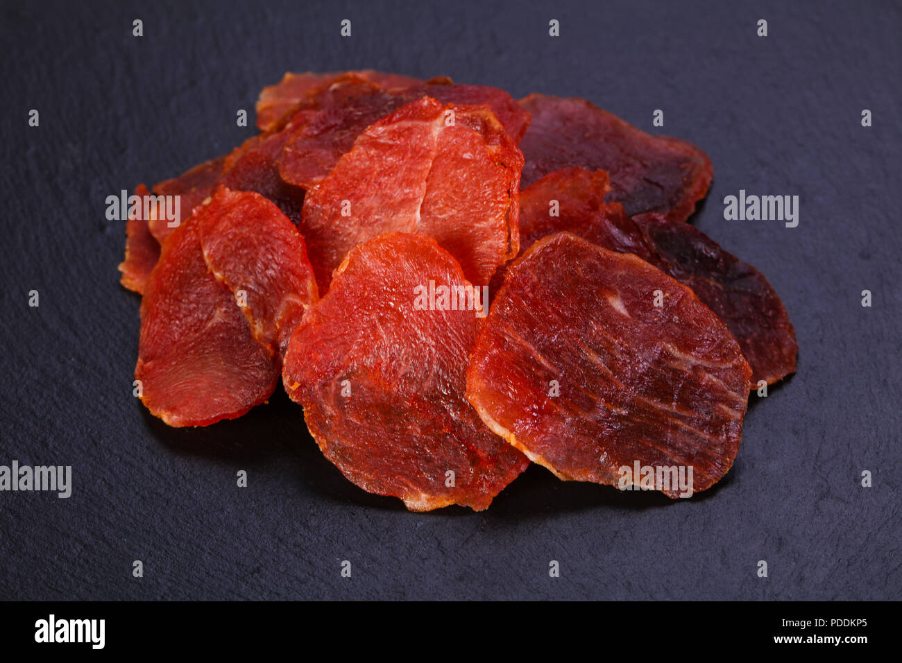 Dry pork meat heap over wooden Stock Photo - Alamy