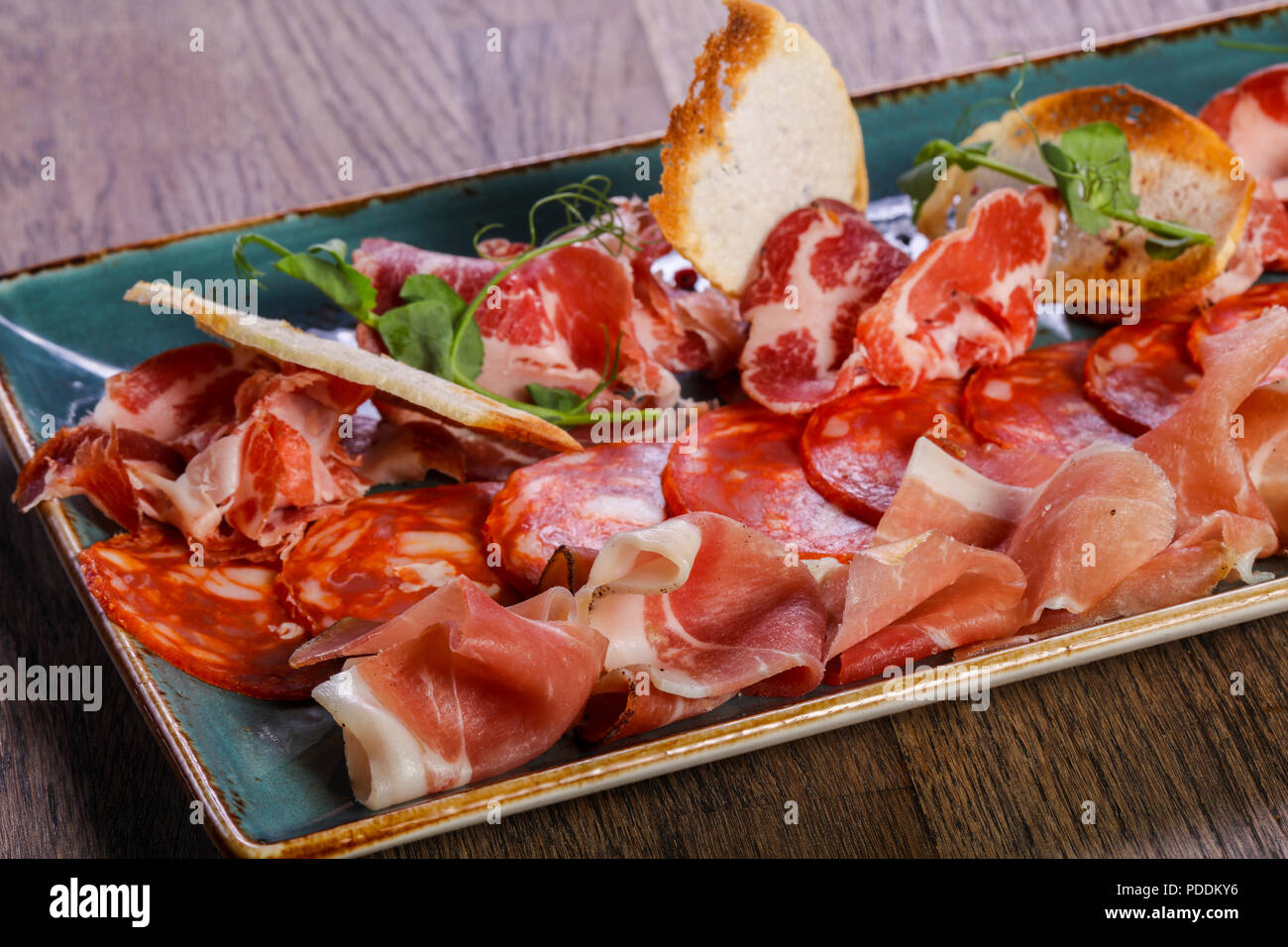 Spanish meat plate - hamon, serrano, chorizzo Stock Photo - Alamy