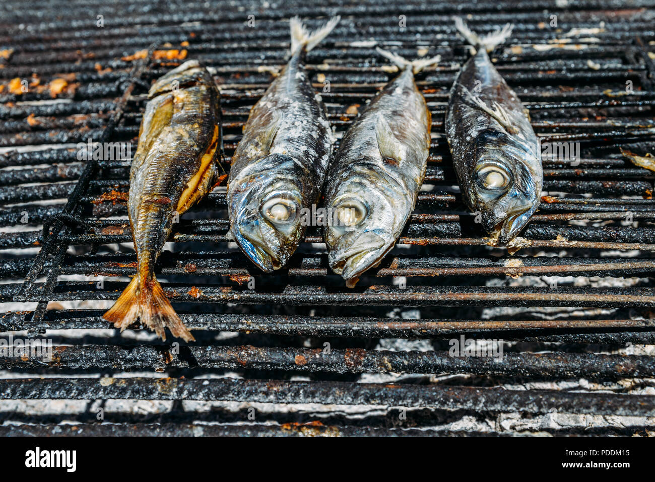 Grilled mackerel fish on the grill closeup Stock Photo - Alamy