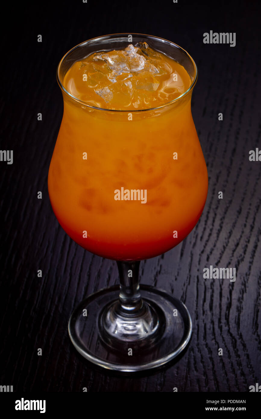 Sweet glass of Tequila Sunrise cocktail Stock Photo - Alamy