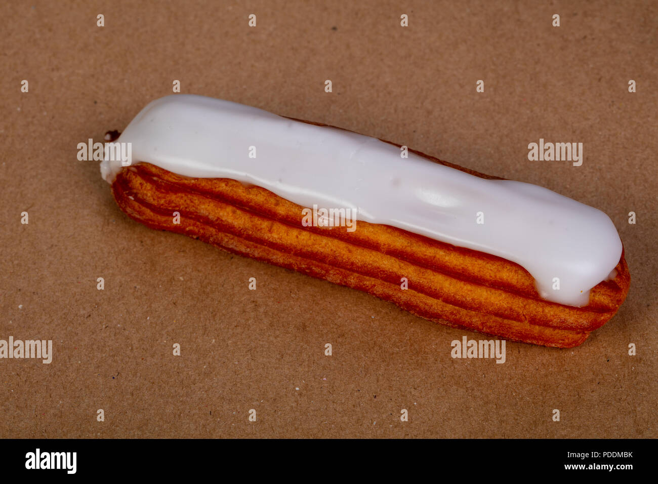 Eclair with cream and icing Stock Photo - Alamy