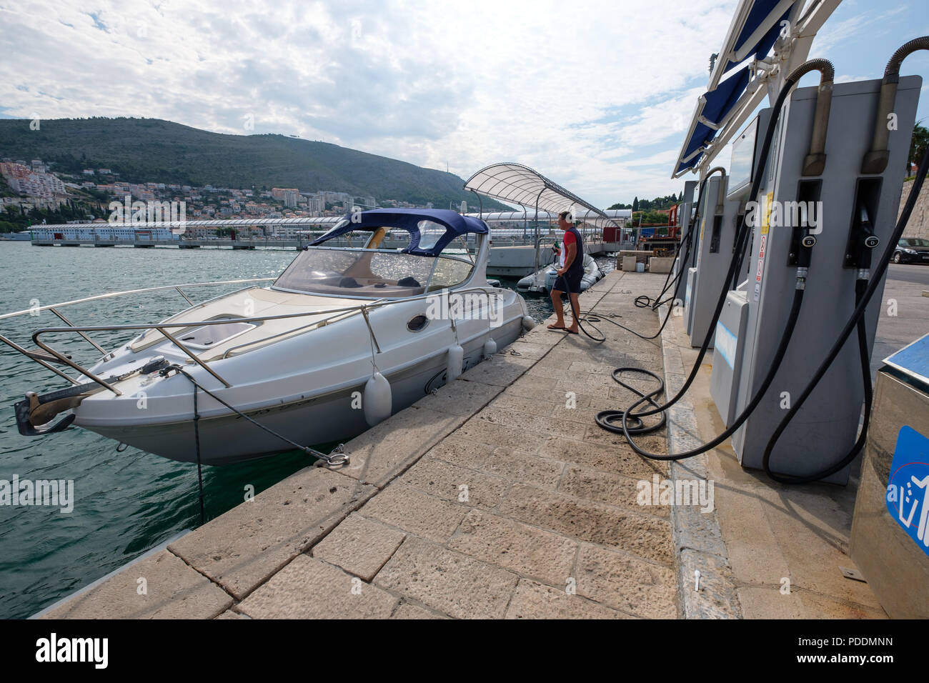 People refueling a speedboat at a petrol station Stock Photo - Alamy