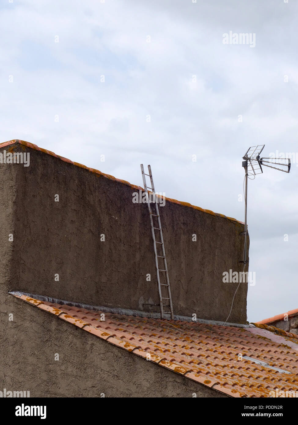 Roof fire escape ladder on the upper terrace of a village house in ...