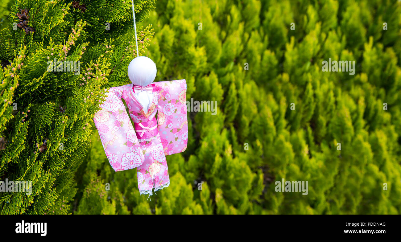 Teru Teru Bozu. Japanese Rain Doll wearing kimono, hanging on tree to ...
