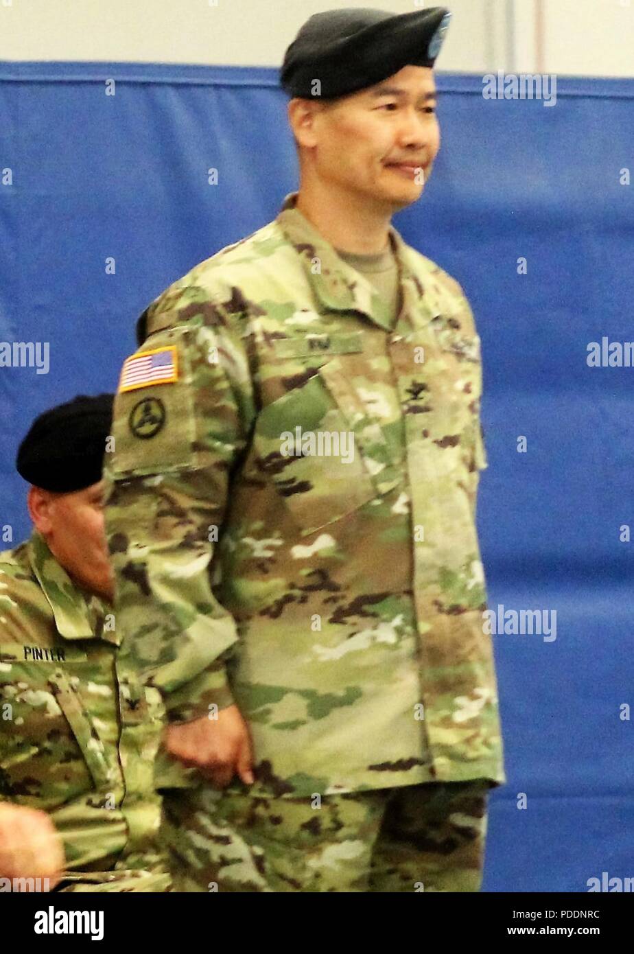 Garrison Commander Col. Hui Chae Kim prepares to salute the color guard ...