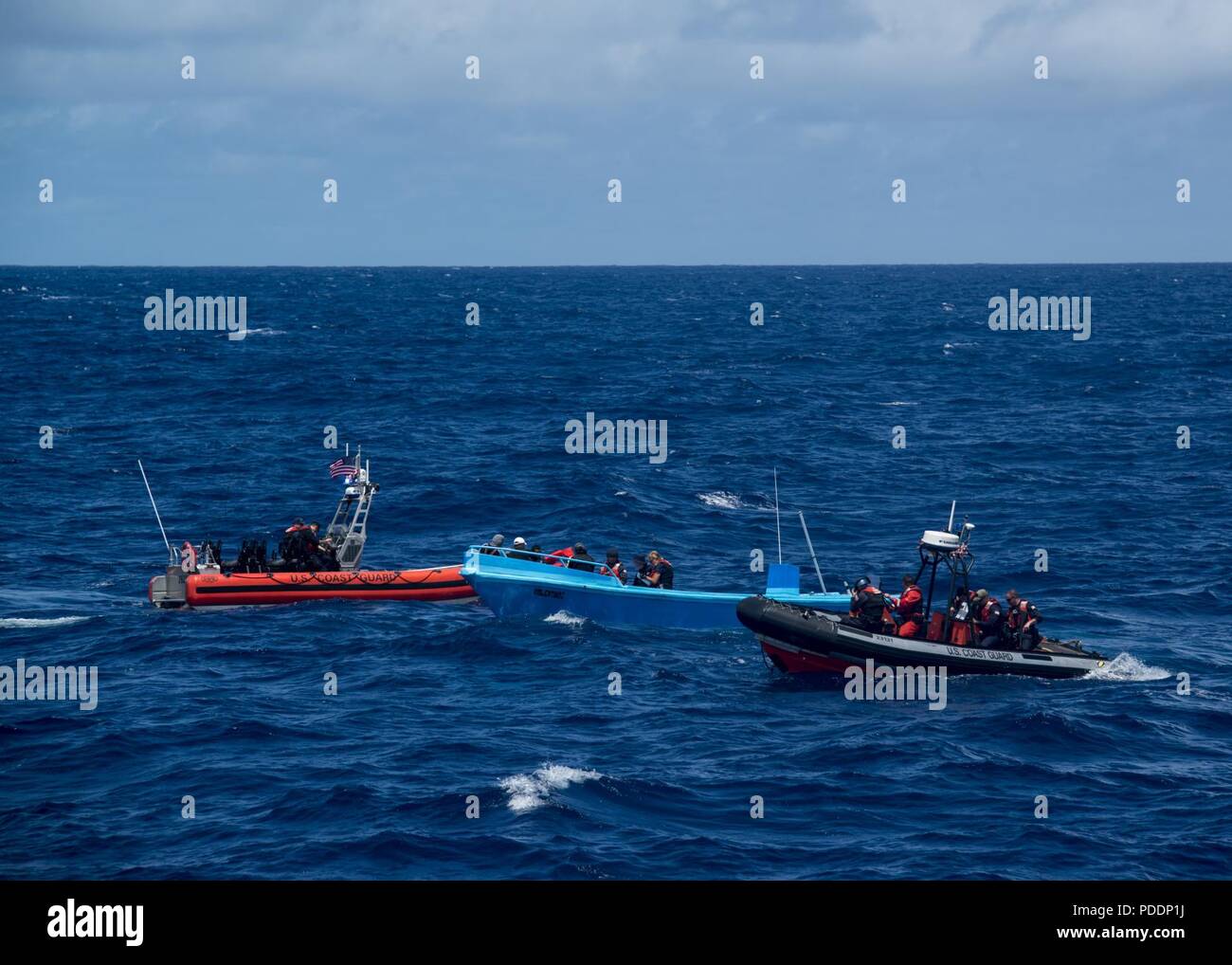 The crew of the Coast Guard Cutter Active, a 210-foot medium endurance ...