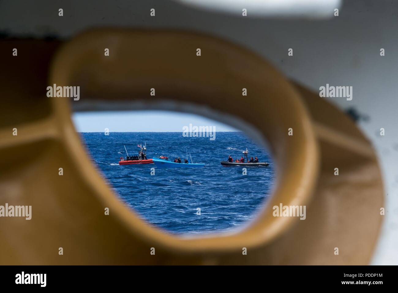 The crew of the Coast Guard Cutter Active, a 210-foot medium endurance ...