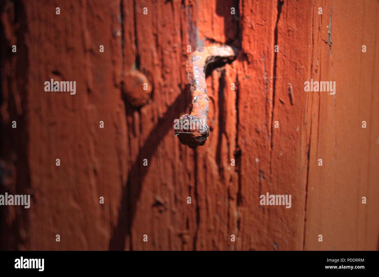 Rusty nail in wall hi-res stock photography and images - Alamy