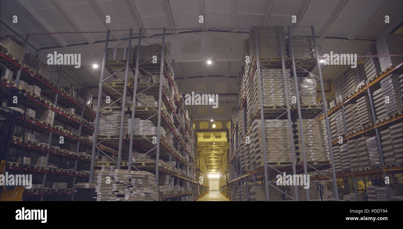 A large warehouse with products from the DCS. Large storage shelves ...