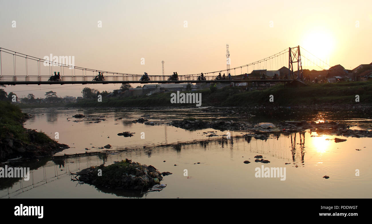 Motorcycle crossed the bridge on the Citarum suspension bridge, Bandung ...