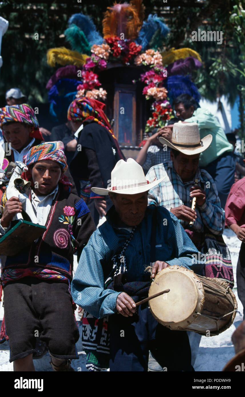 Musicians wearing traditional dress and walking through the street in ...