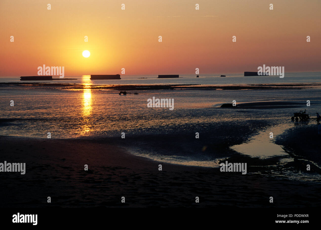 Sunset on Phoenix caissons at Mulberry harbour, Arromanches - Normandy ...