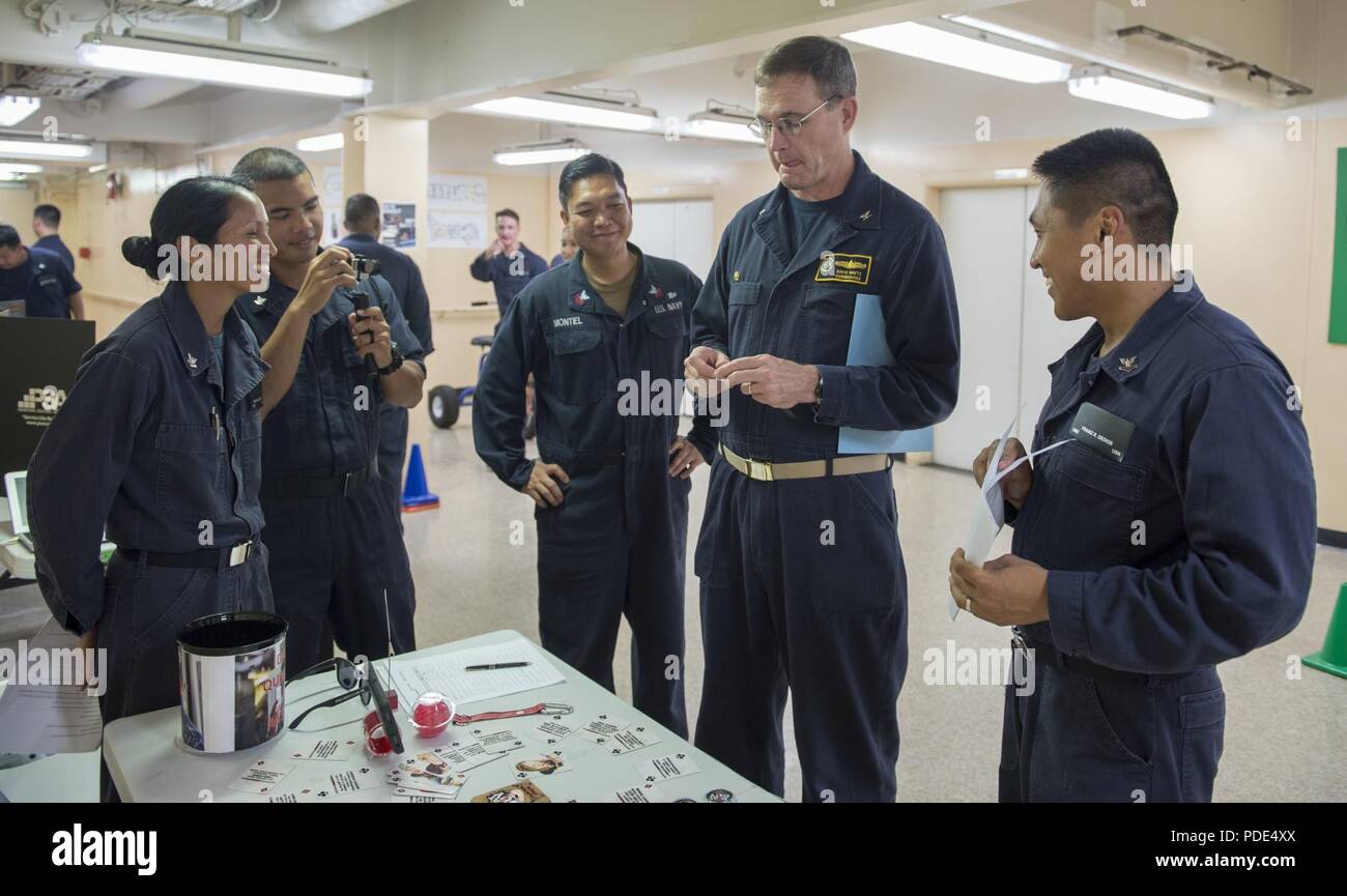 OCEAN (May 12, 2018) Capt. David Bretz, center right, mission commander ...