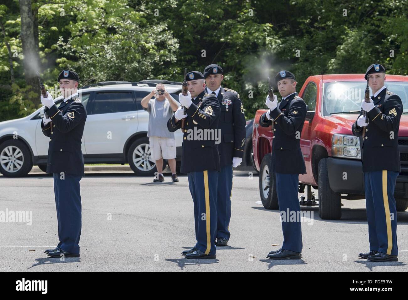 Members of the West Virginia Army National Guard fire their rifles in a ...