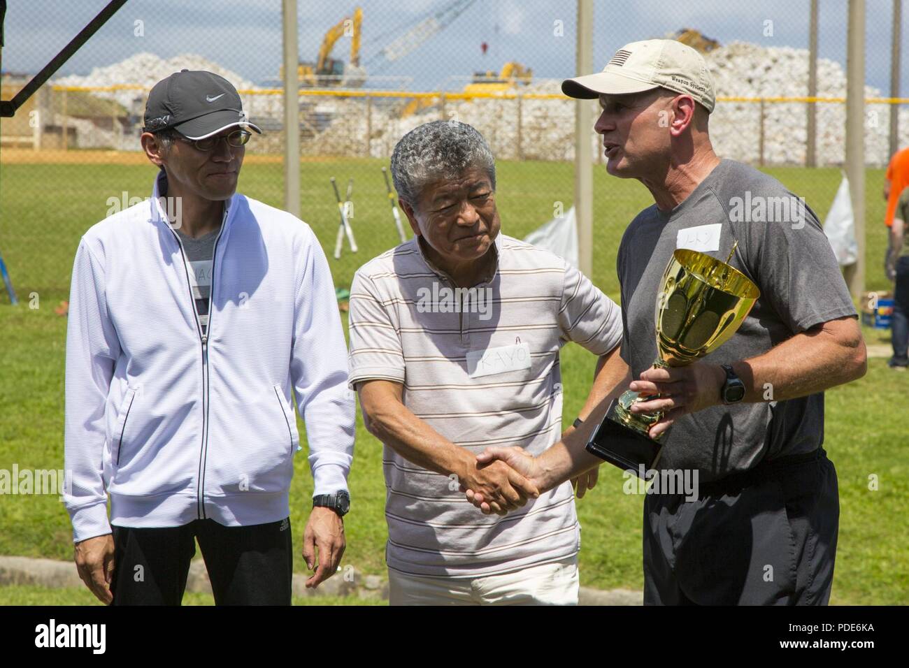 CAMP SCHWAB, OKINAWA, Japan- Col. Kevin Norton, right, shakes hands ...