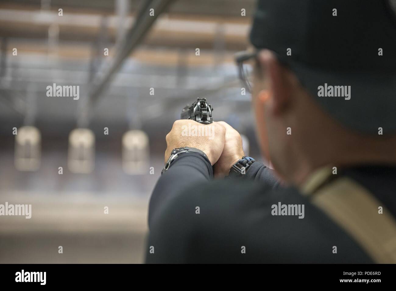 Goldsboro Police Department Investigator Jason Booker shoots at a ...