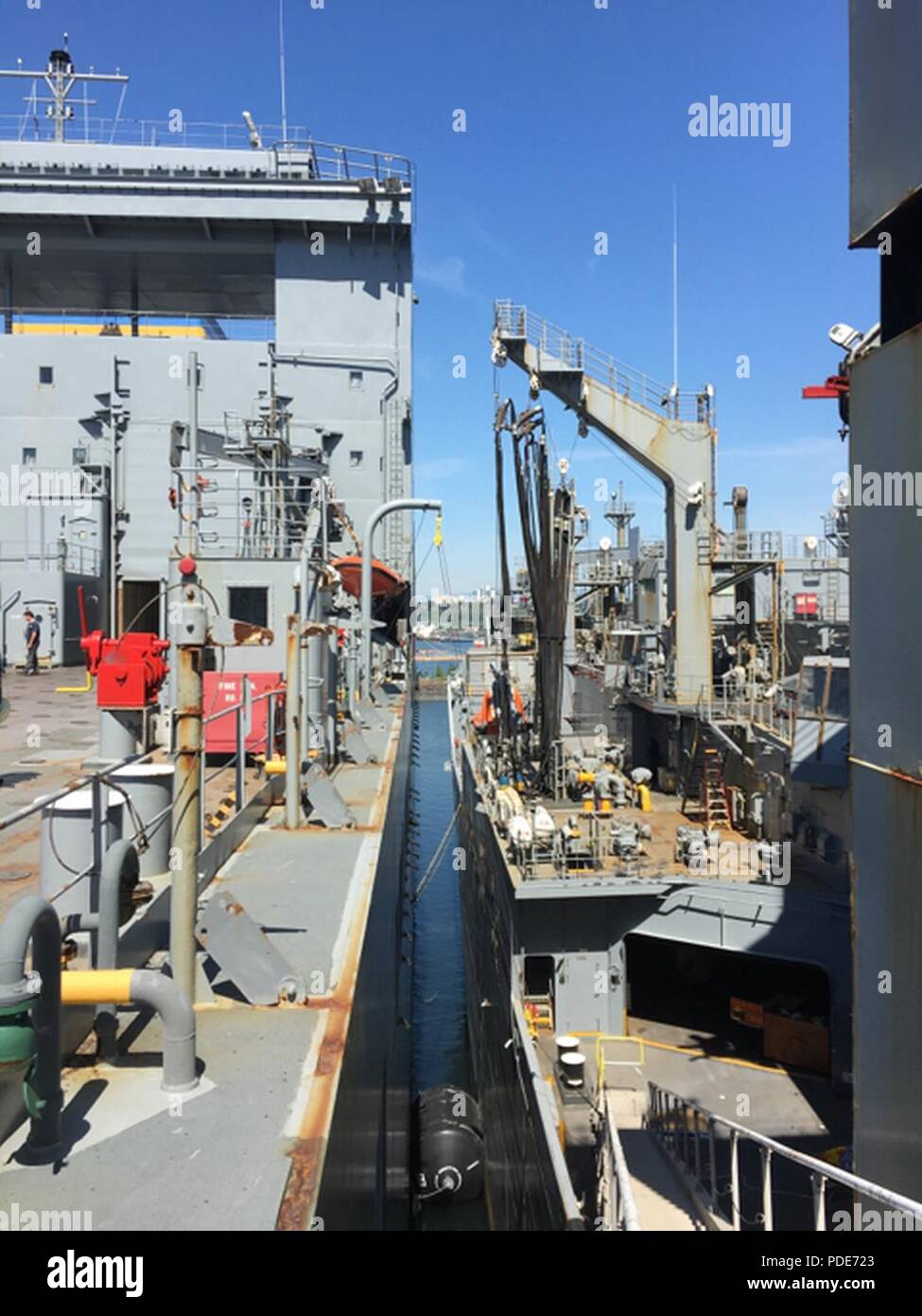 Military Sealift Command ships USNS Carl Brashear (T-AKE 7) and USNS Bob Hope (T-AKR 300) moor ...