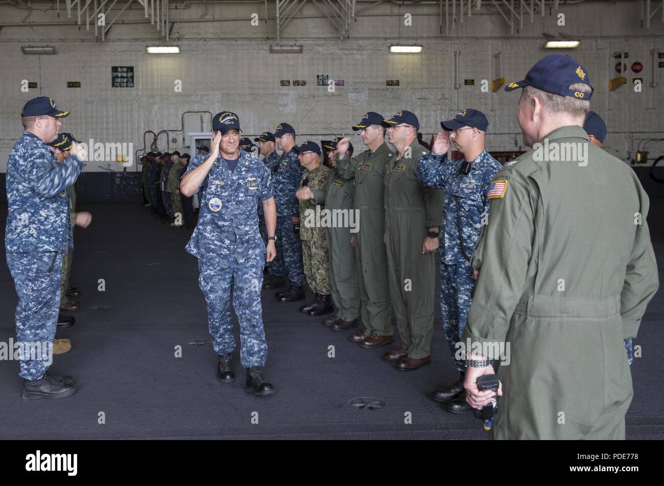 Va. (May 16, 2018) – Lt. Cmdr. Joshua Fischer returns the salute of USS ...