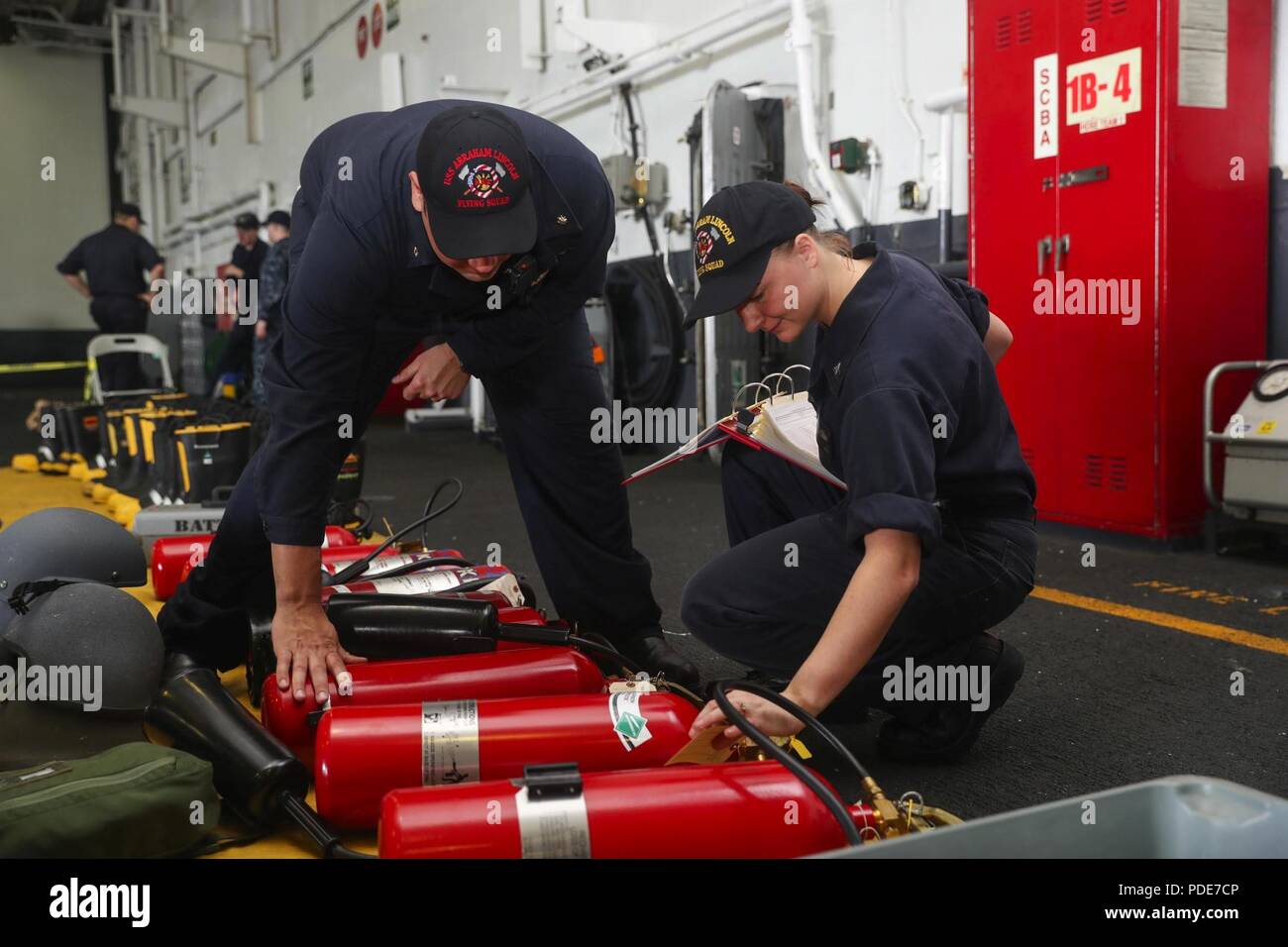 (May 14, 2018) Damage Control Assistant Lt. Cmdr. Michael Carter (left ...