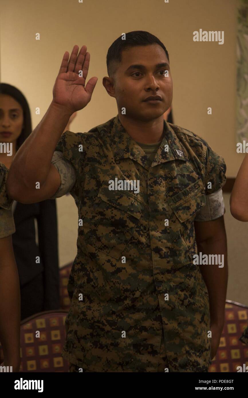 CAMP FOSTER, OKINAWA, Japan – Sgt. Nelson Sigrah recites the Oath of ...