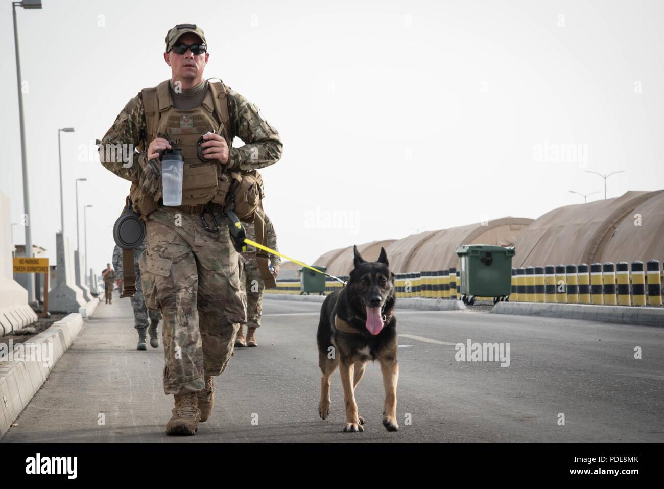 Members from Al Dhafra Air Base participate in a 5k run and ruck march ...