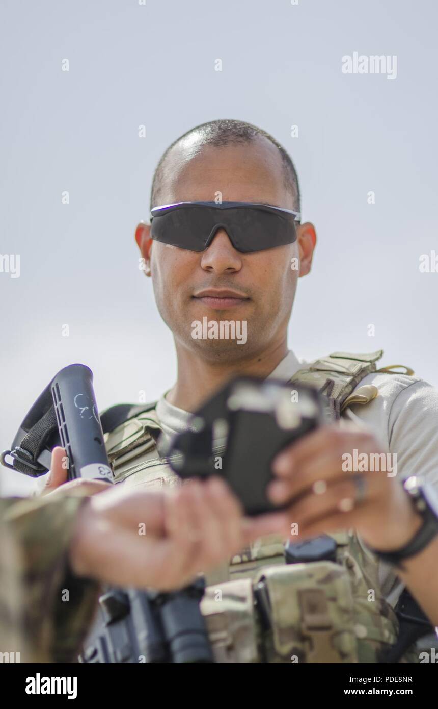 Senior Airman Alexander Hunter, 380th Security Forces, verifies ...