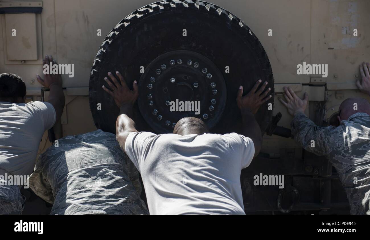 First Sergeants push a Humvee during a stage of the Combat Fitness ...