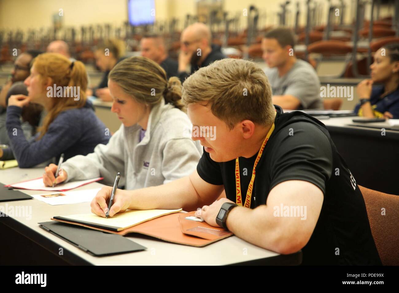 Emma Celentano, Maddy Evans and Will Finley takes notes during a ...