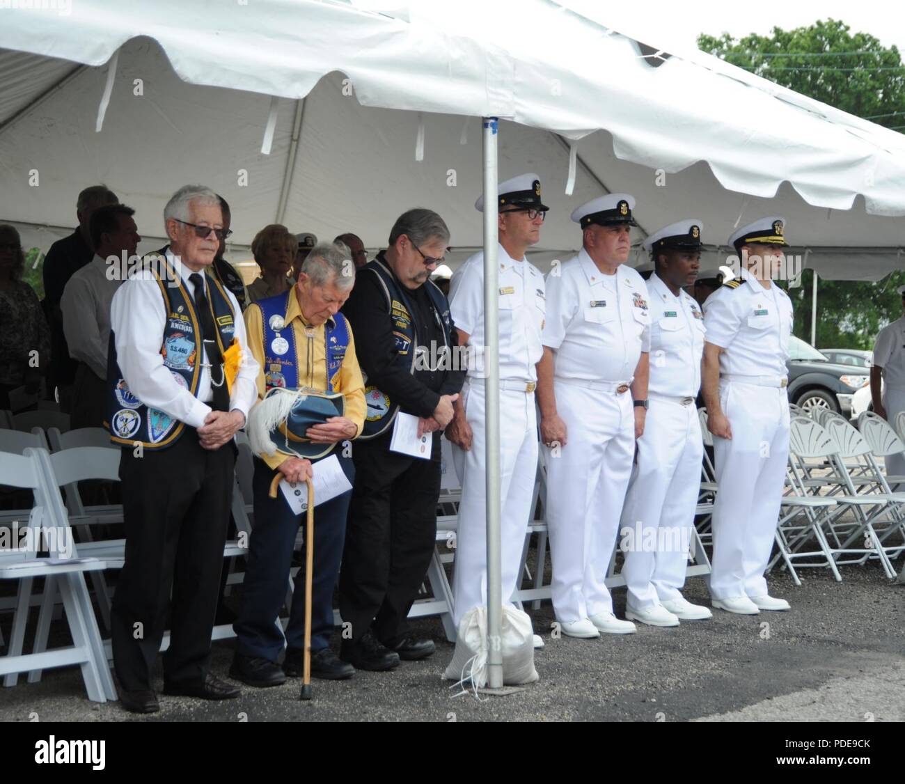 Submarine veterans, active duty submariners, family and friends stand ...