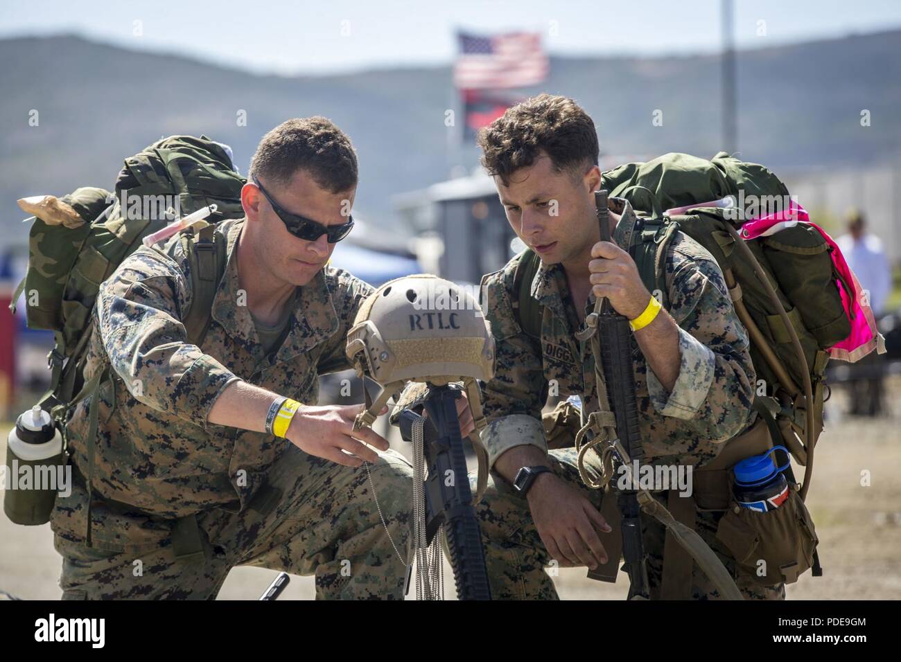 Staff Sgt. Curtis Garrison, left, range scheduler, Headquarters and ...