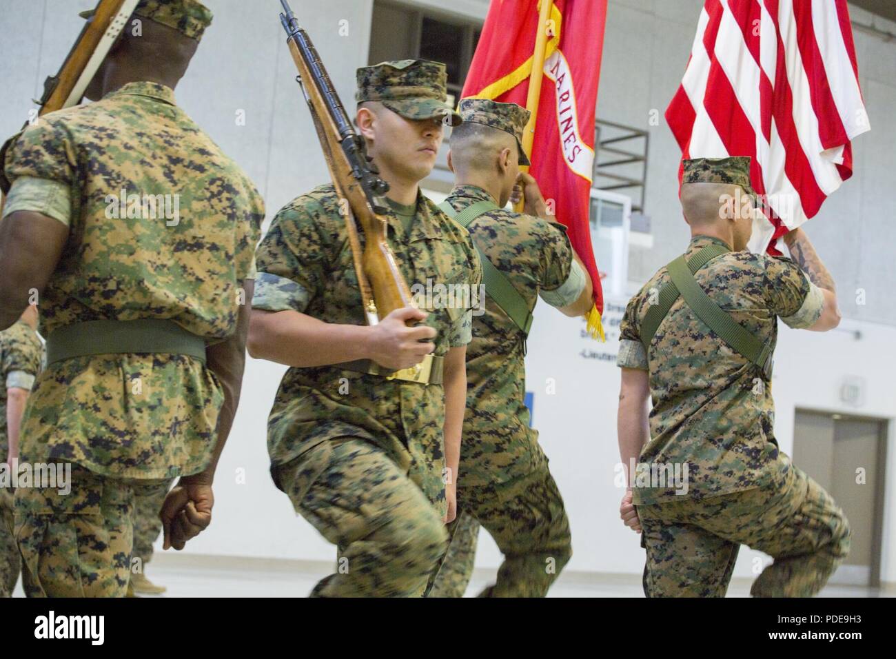 Marines with the 23rd Regimental Color Guard march to Colors during a ...