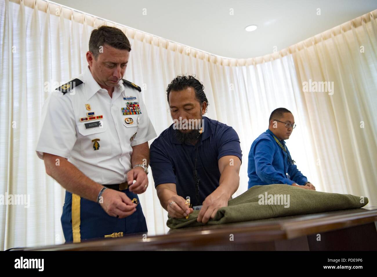 U.S. Army Sgt. 1st Class Nathan Austin, left, Larry Magaoay, Casualty ...