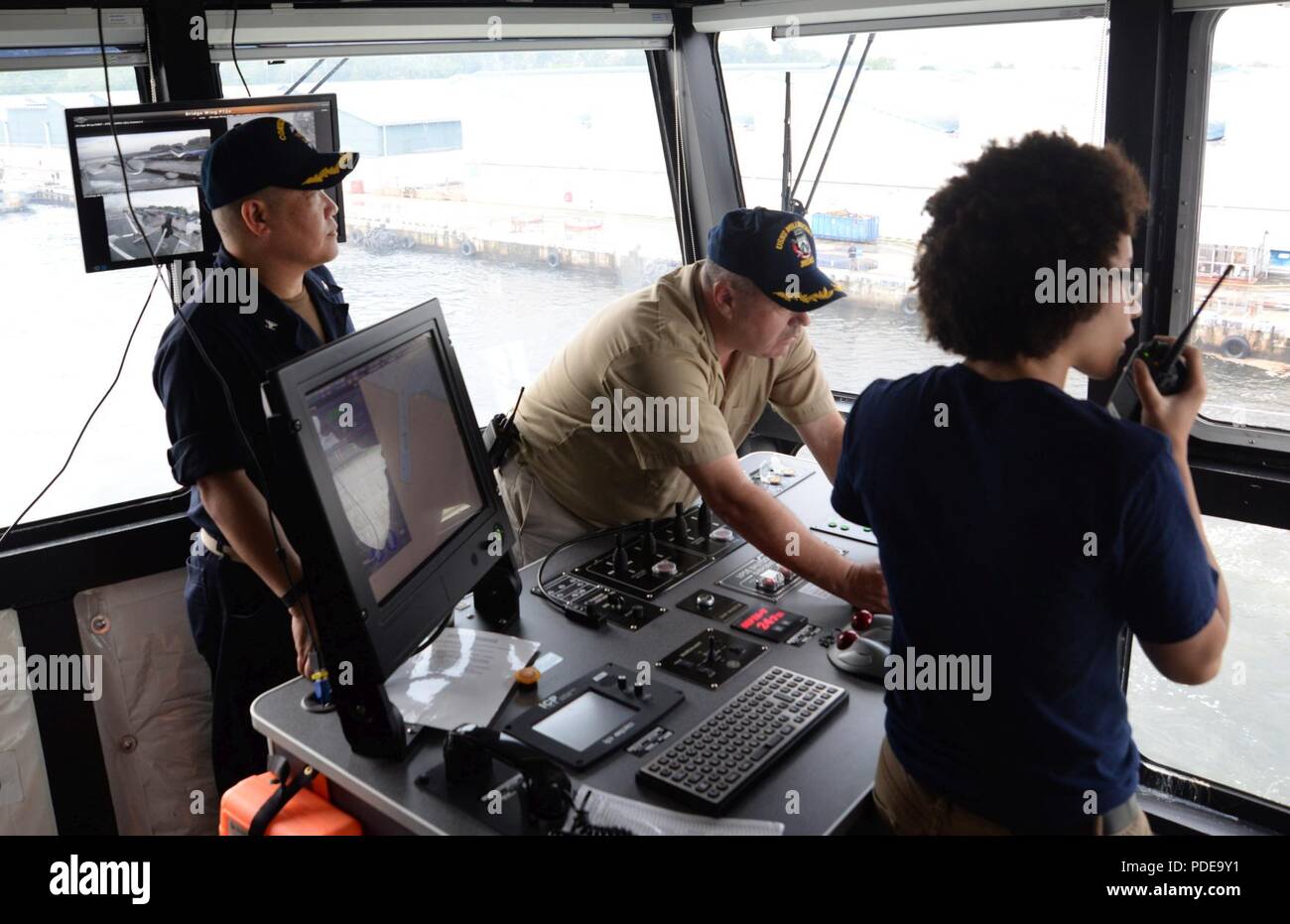 SINGAPORE (May 19, 2018) Capt. Bernard Wang, left, mission commander ...