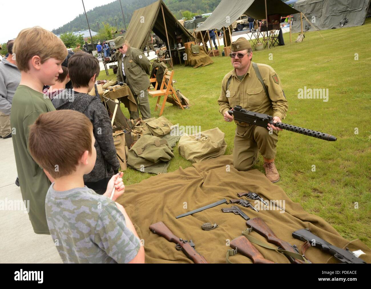 Ryan McGee, a member of the 1st Infantry Living History Group, shows ...