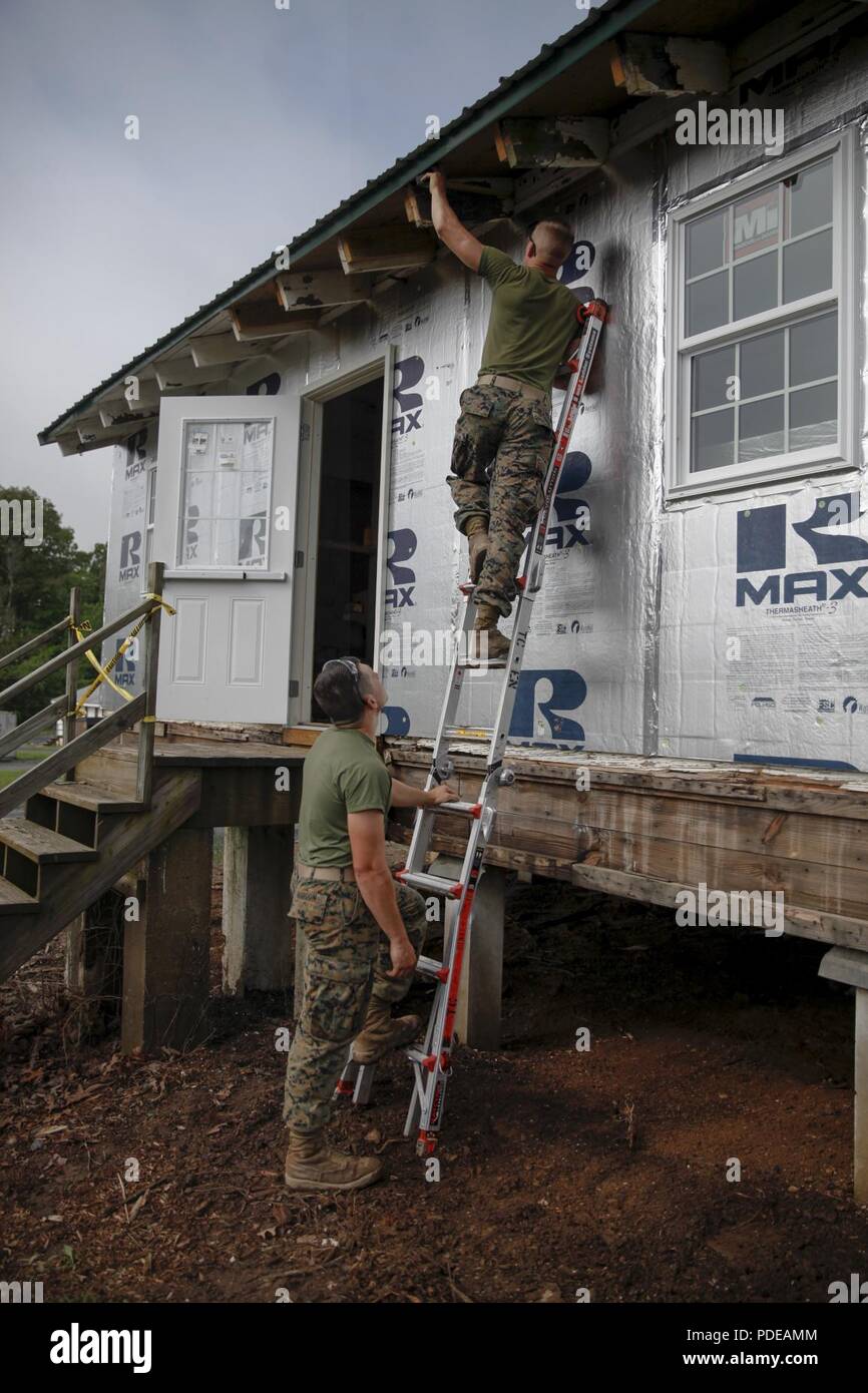 U.S. Marine Private First Class Jeffrey Beasley (top), combat engineer ...