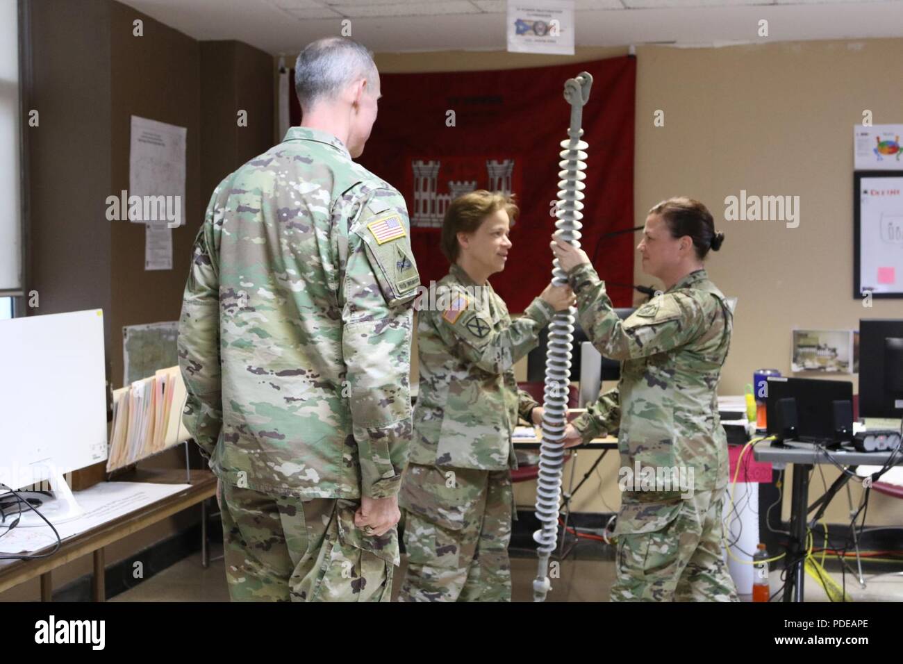 U.S. Army Colonel Jason Kirk conducts a battle rhythm handover to LTC ...