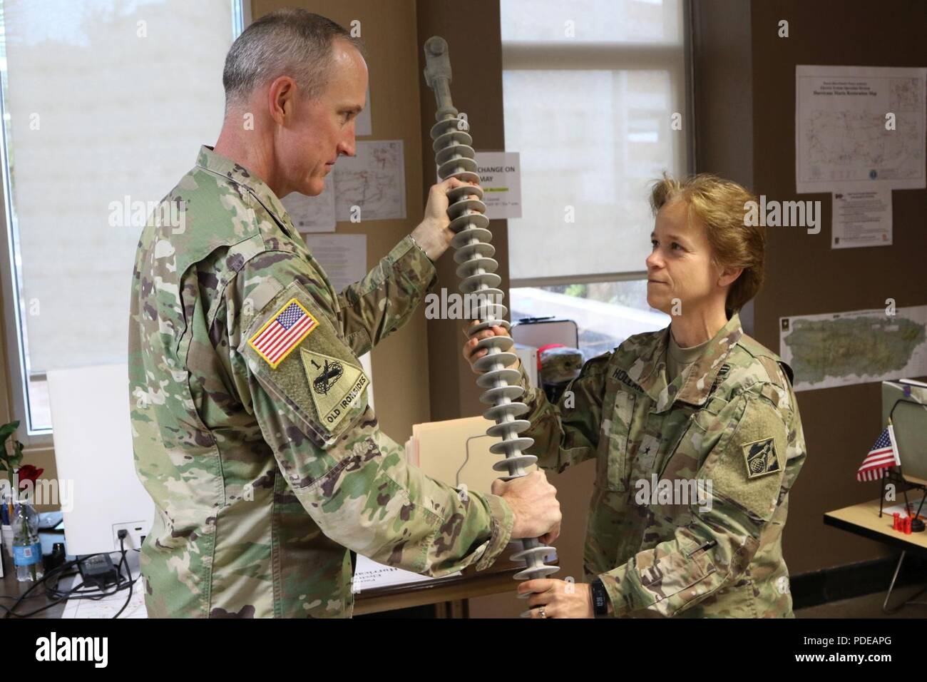 U.S. Army Colonel Jason Kirk conducts a battle rhythm handover to LTC ...