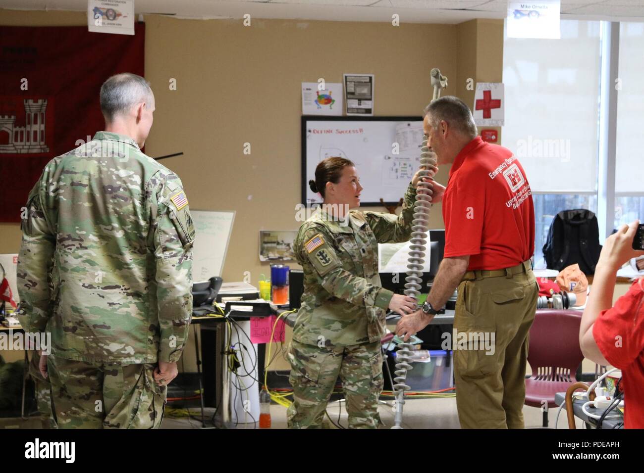 U.S. Army Colonel Jason Kirk conducts a battle rhythm handover to LTC ...