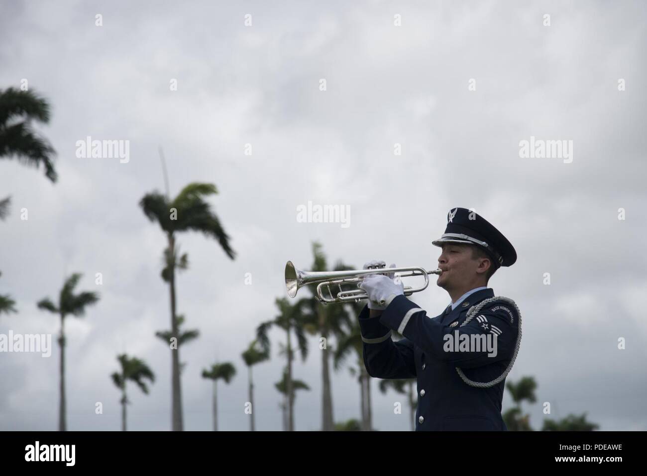 Senior Airman Gabriel Fox plays Taps during the funeral of Master Sgt ...