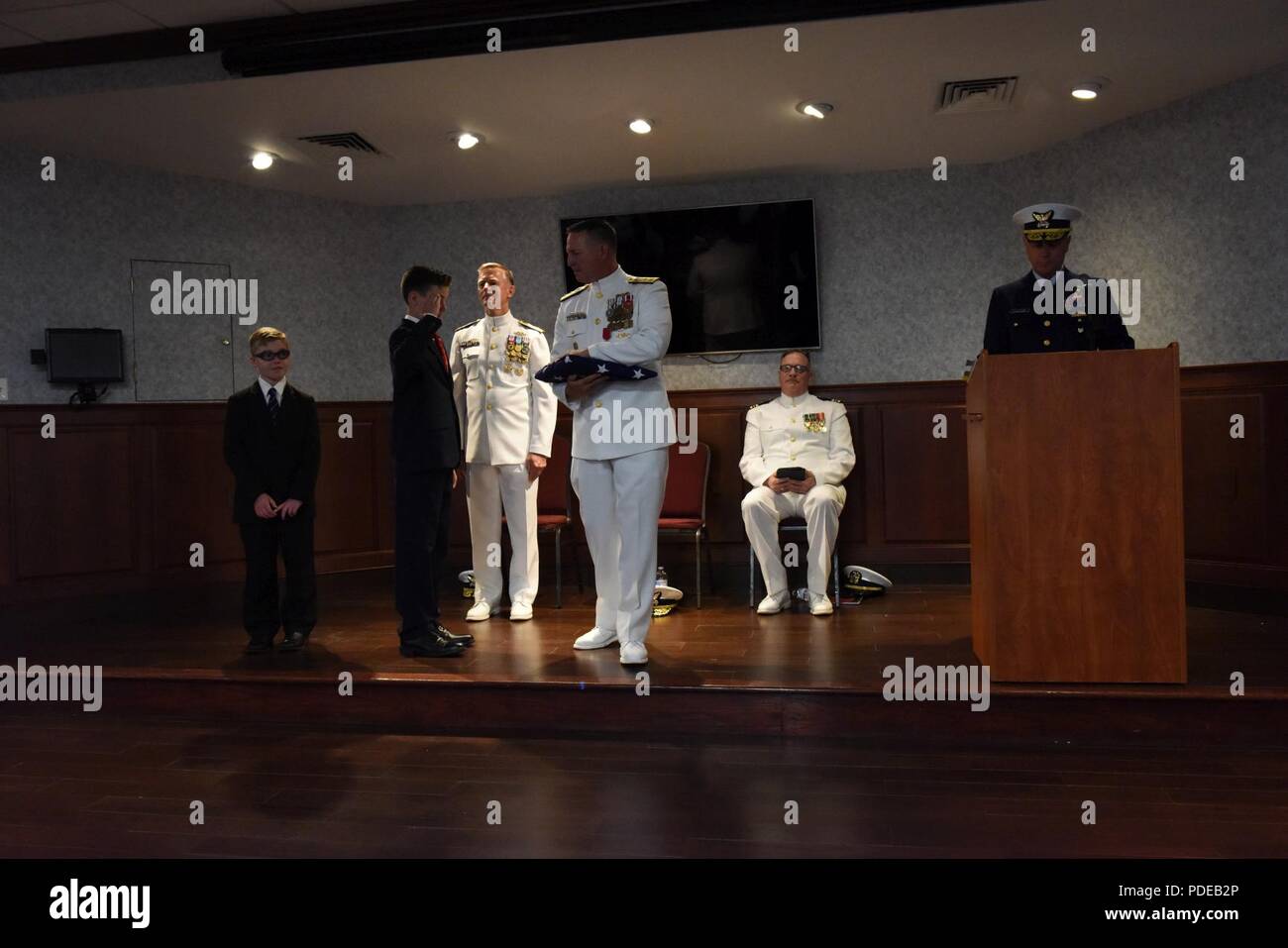 U.S. Coast Guard Reserve Rear Adm. Francis “Stash” Pelkowski receives a ...