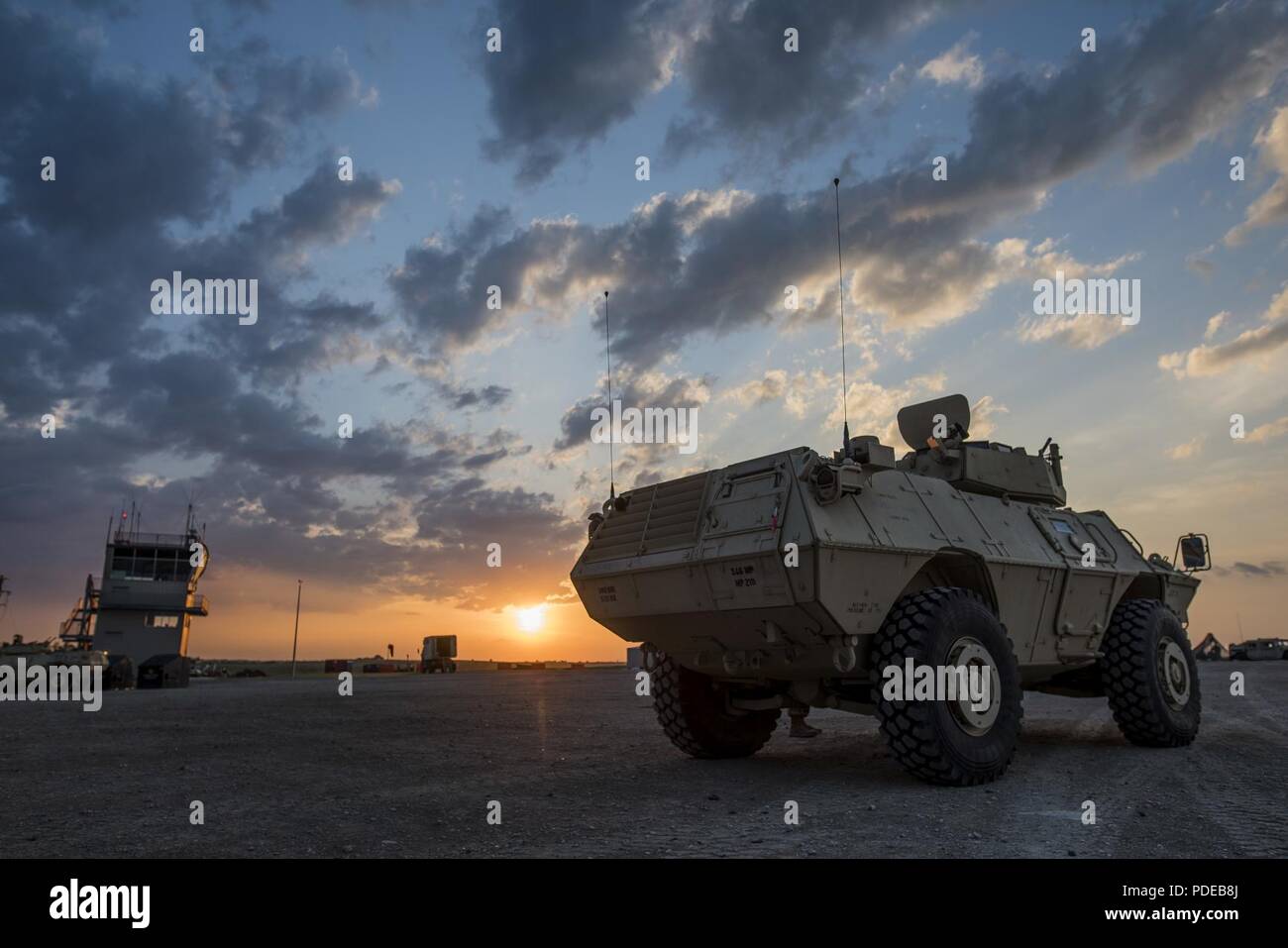 An Armored Security Vehicle is staged during sunset in preparation for ...