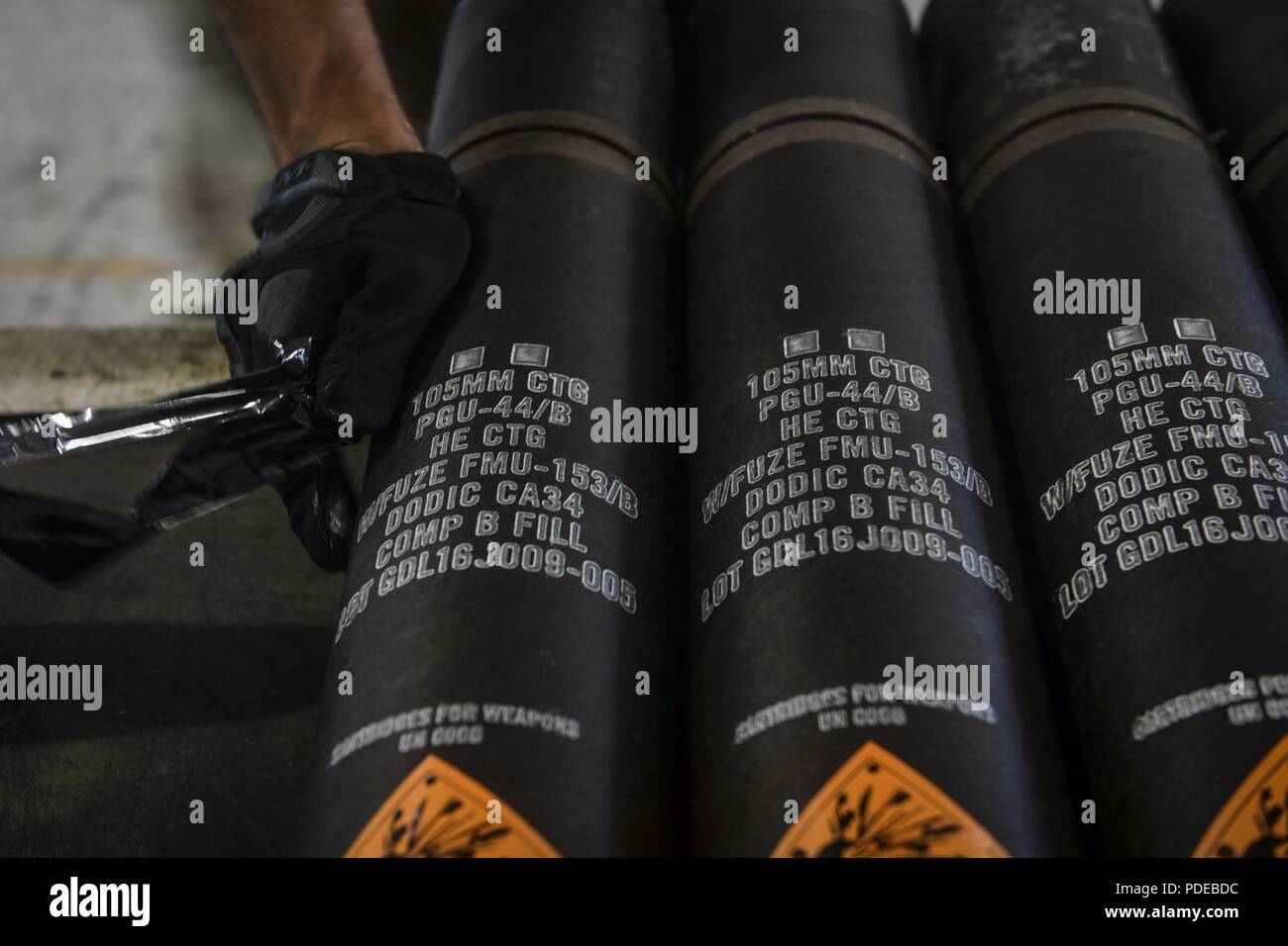 105mm high explosive rounds lay on a table at Hurlburt Field, Fla., May ...