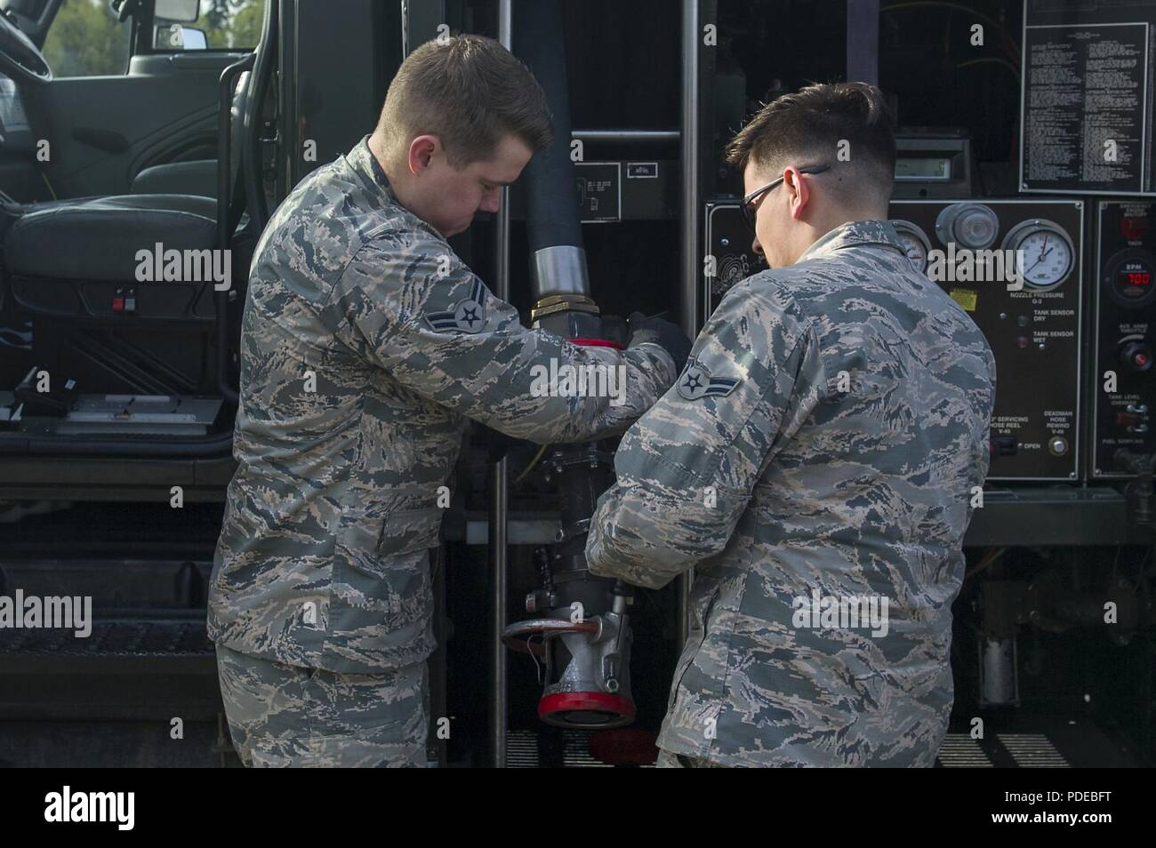 U.S. Air Force Airmen 1st Class Kyle McClelland and Zachary Ornelas ...