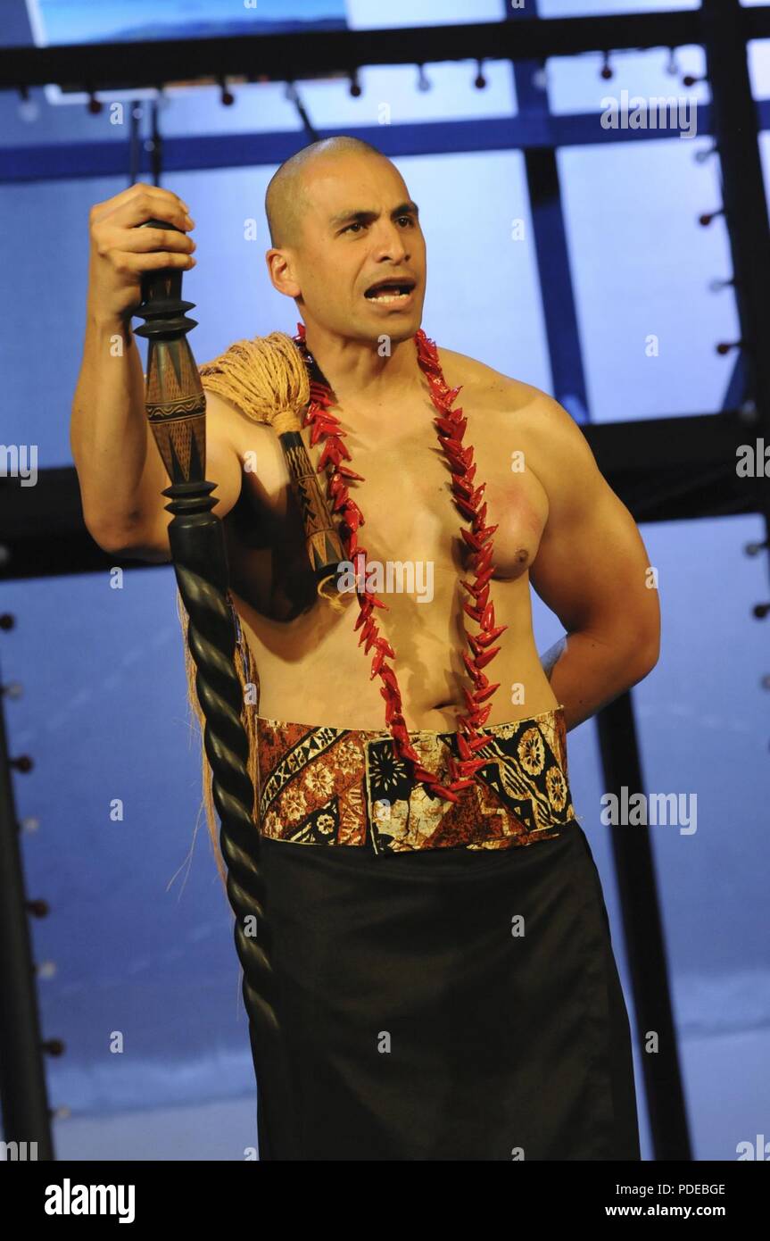 Capt. Lloyd Alaimalo, dressed traditional Samoan garb, speaks to the ...