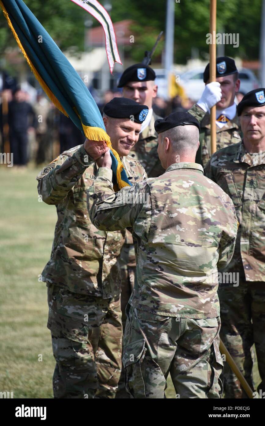 U.S. Army Brig. Gen. Christopher C. LaNeve, left, receives the colors ...