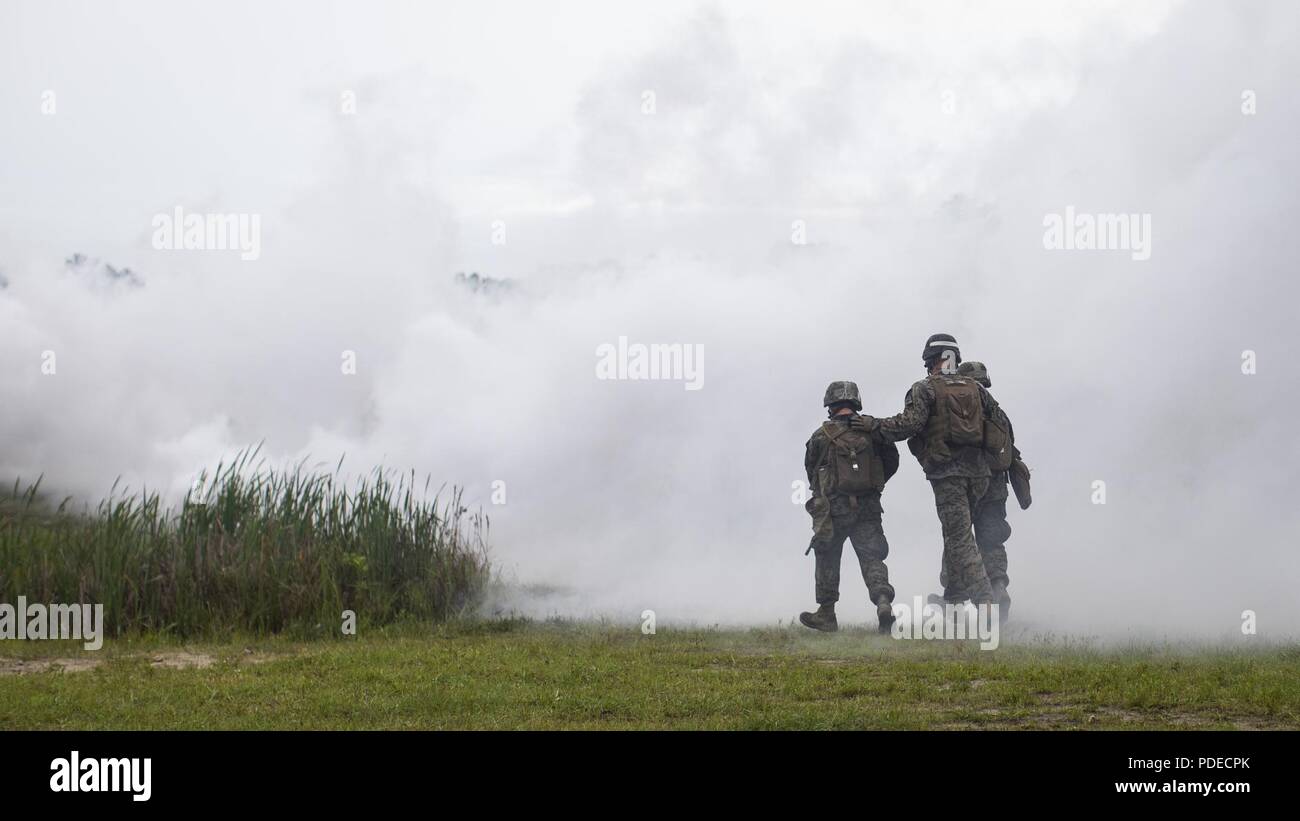 U.S. Marine Corps Sgt. Thomas J. King, center, a combat instructor ...