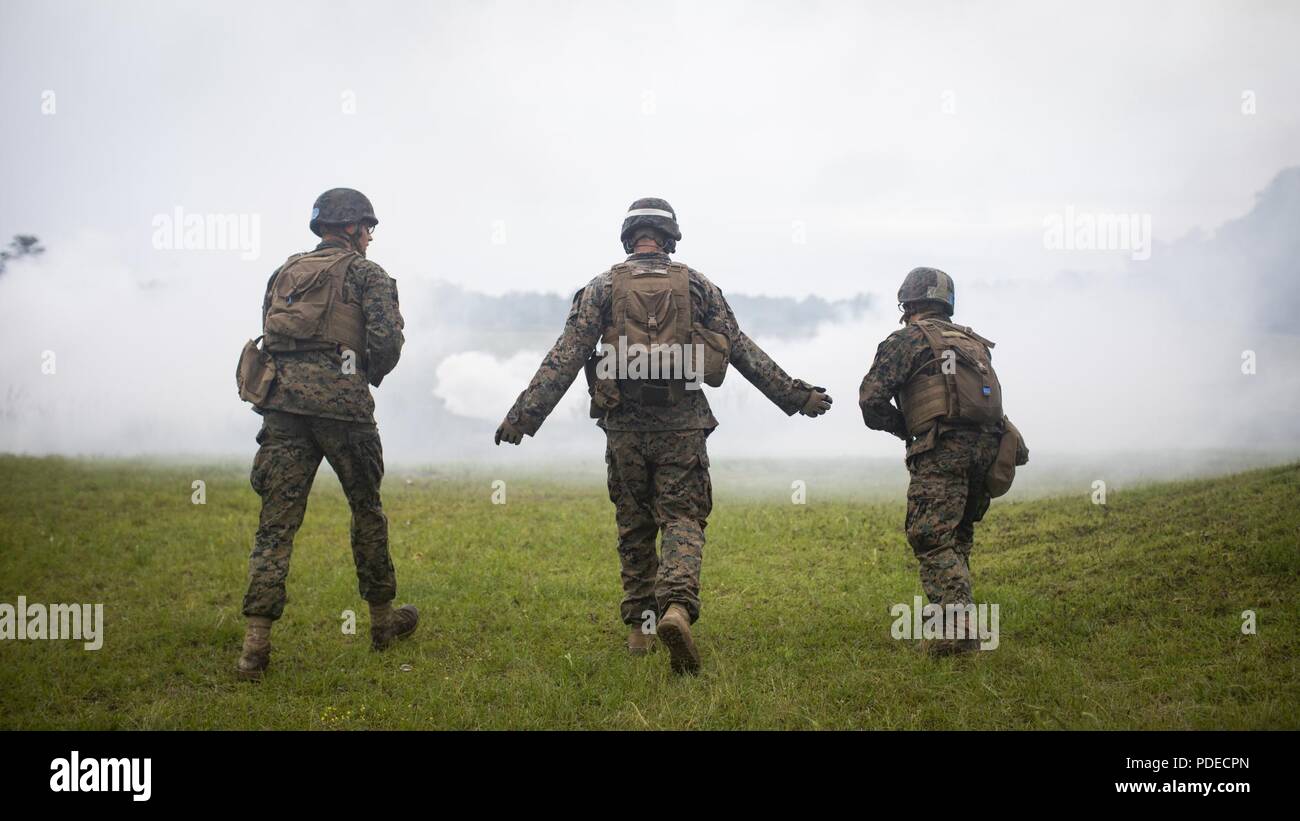 U.S. Marine Corps Sgt. Thomas J. King, center, a combat instructor ...